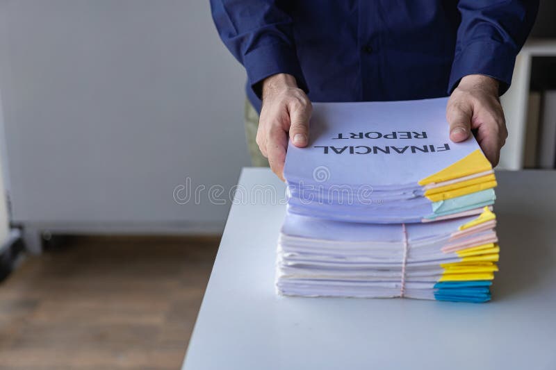 Businessman Working in a Pile of Documents Find Information about ...