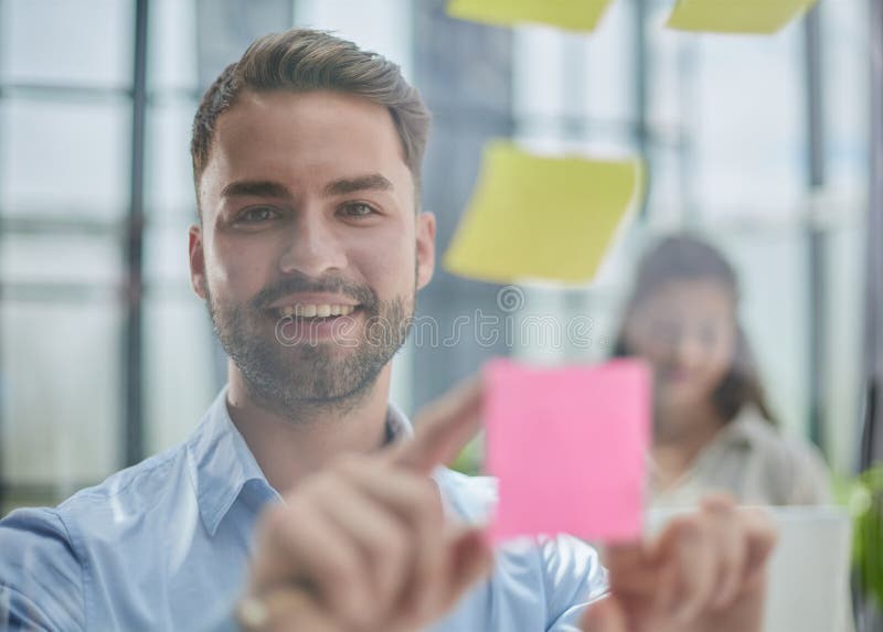 Businessman is Working on a Project. Business Man Pointing at a Note on ...