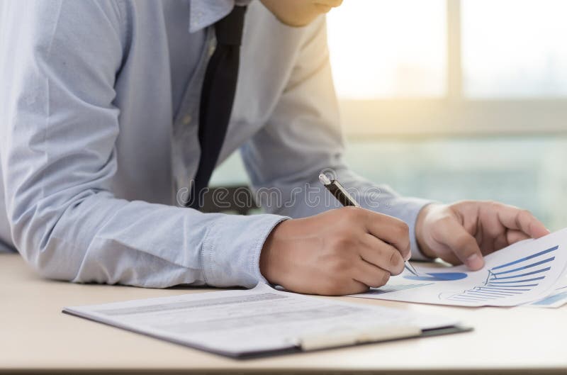 Businessman Working Reading Documents Graph Financial To Job Succes ...