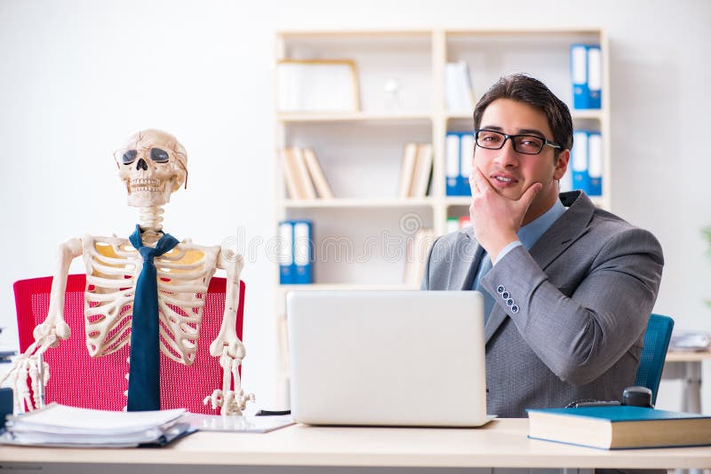 The Businessman Working with Skeleton in Office Stock Photo - Image of ...
