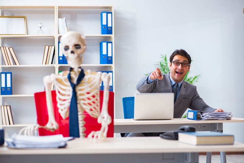 The Businessman Working with Skeleton in Office Stock Photo - Image of ...