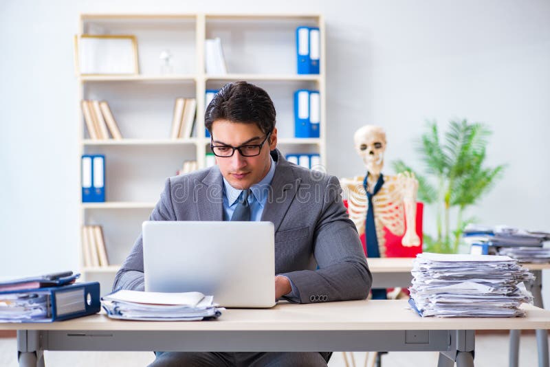 The Businessman Working with Skeleton in Office Stock Photo - Image of ...