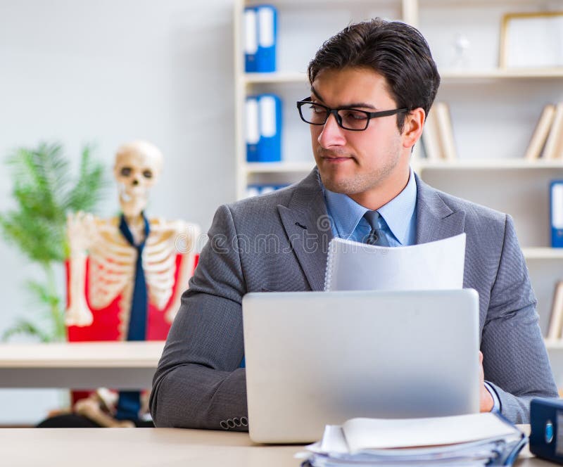 Businessman Working with Skeleton in Office Stock Image - Image of ...