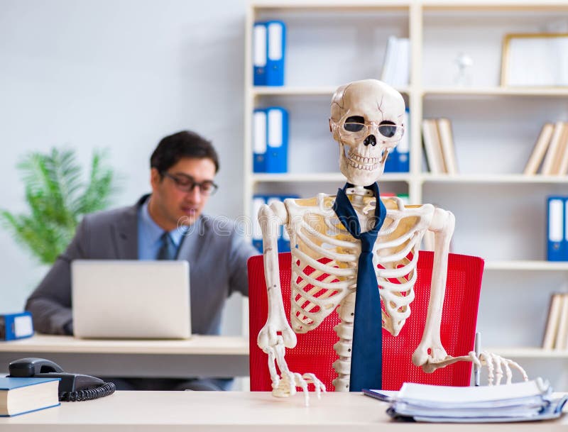 Businessman Working with Skeleton in Office Stock Image - Image of dead ...