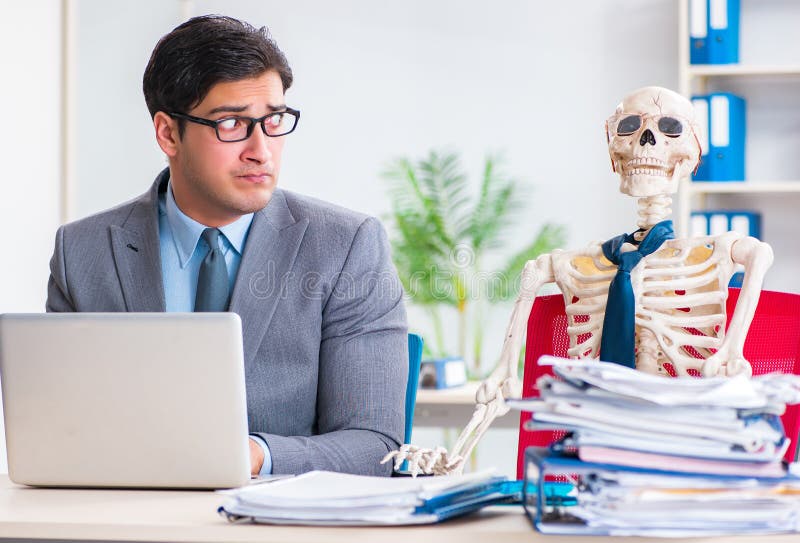 Businessman Working with Skeleton in Office Stock Image - Image of ...