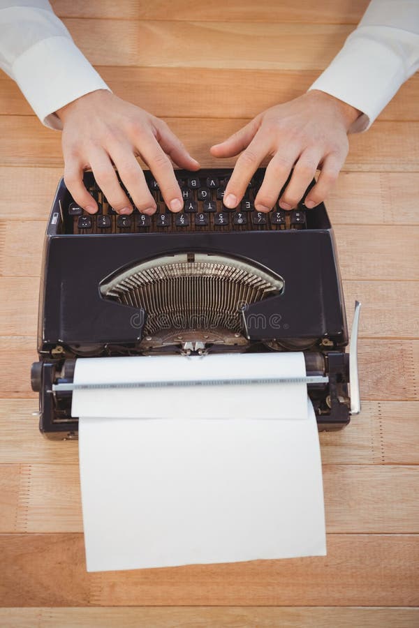 Businessman Working on Typewriter at Table in Office Stock Photo ...