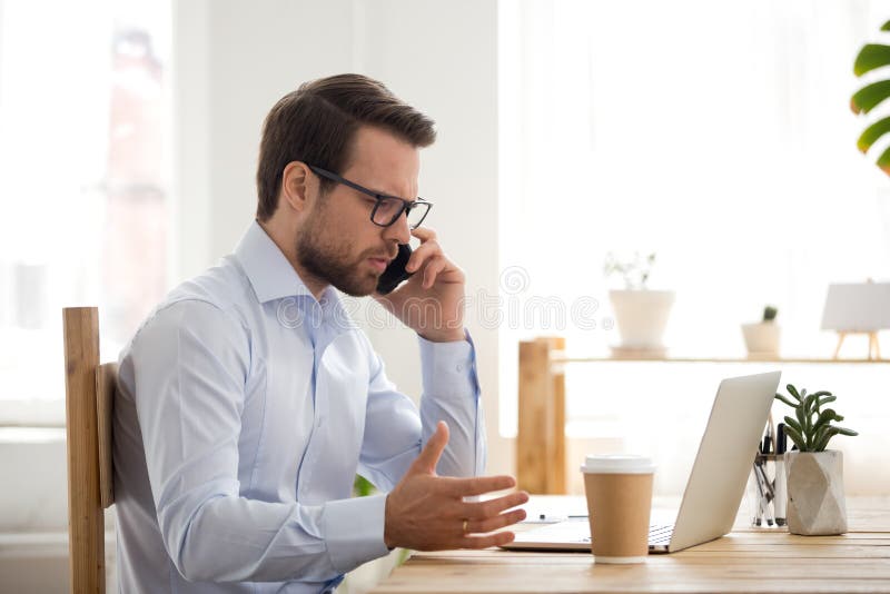Businessman Working Using Smartphone and Computer in Office Stock Image ...