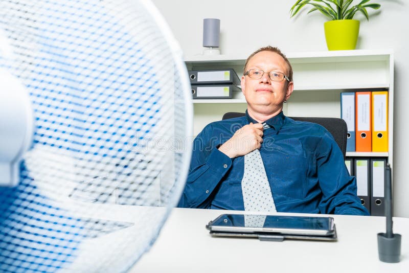 Businessman Works during a Heat Wave in the Office Stock Photo - Image ...