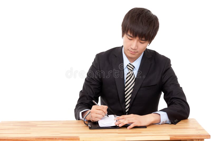 Businessman Writing at a Desk with a Pen Stock Image - Image of ...