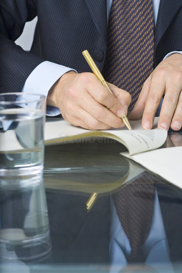 Businessman Writing in a Document Stock Image - Image of business ...