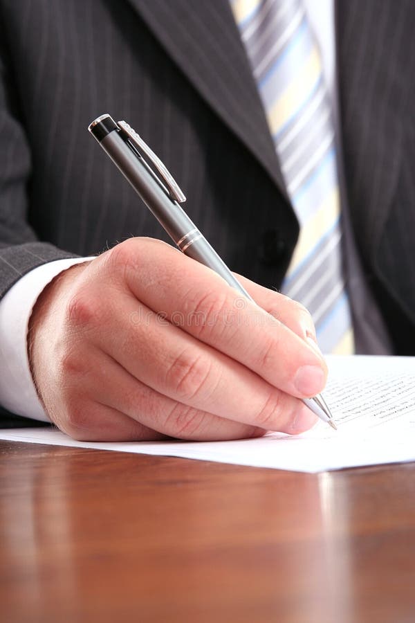 Businessman Writing on a Form Stock Photo - Image of businessman ...