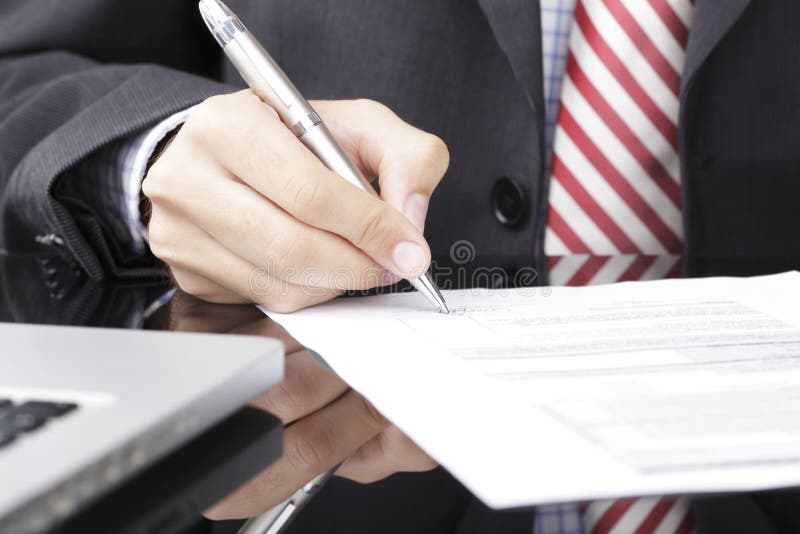 Businessman Writing on a Form Stock Photo - Image of filling, signing ...