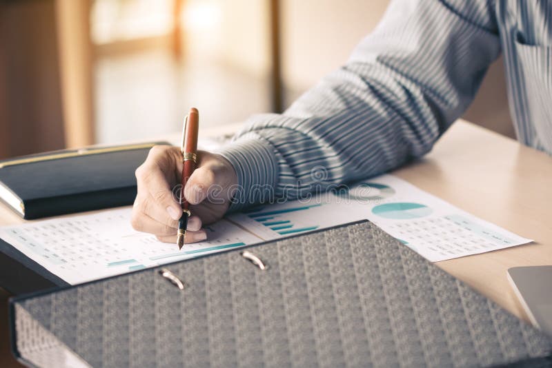 Businessman Writing Make Note on Paperwork Chart Summary Report Stock ...