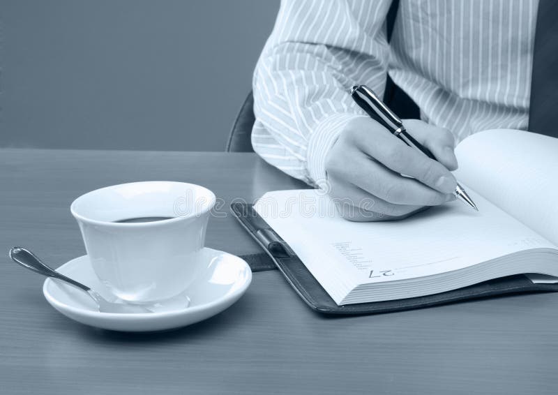 Businessman Writing a Note at His Stock Image - Image of desk ...