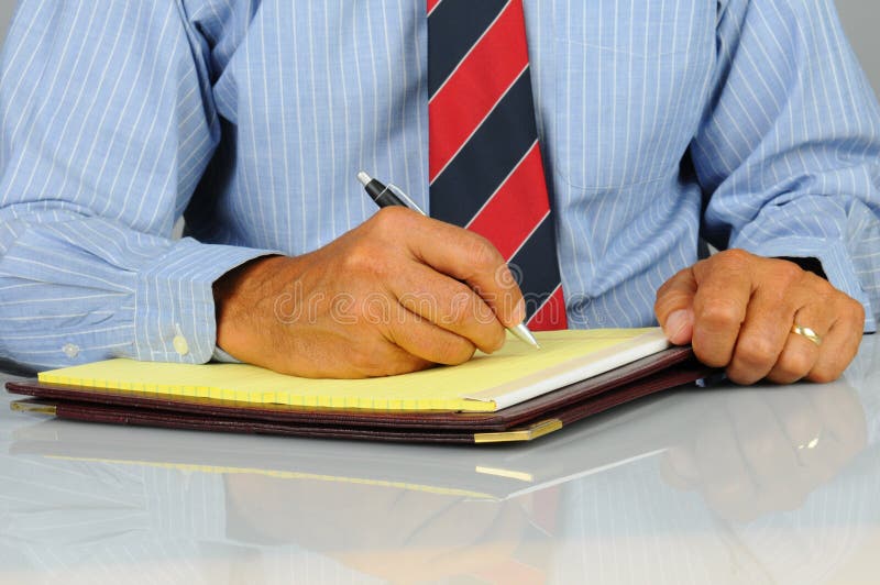 Businessman Writing in Note Pad Stock Photo - Image of male, closeup ...