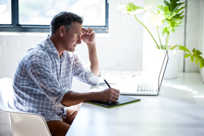 Businessman Writing on a Notepad Stock Photo - Image of notepad ...