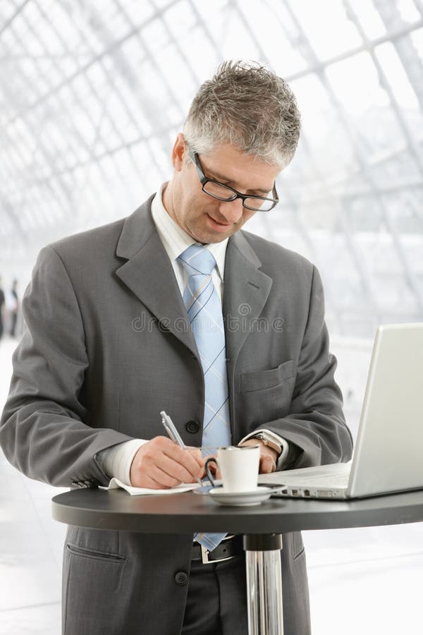 Businessman writing notes stock photo. Image of employment - 11396202
