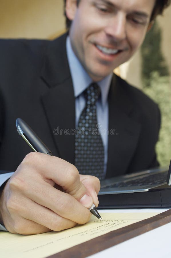 Businessman Writing Notes stock photo. Image of profession - 29659012