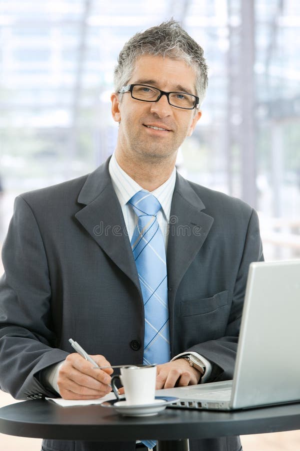 Businessman Writing on Paper Stock Image - Image of adult, color: 9247491