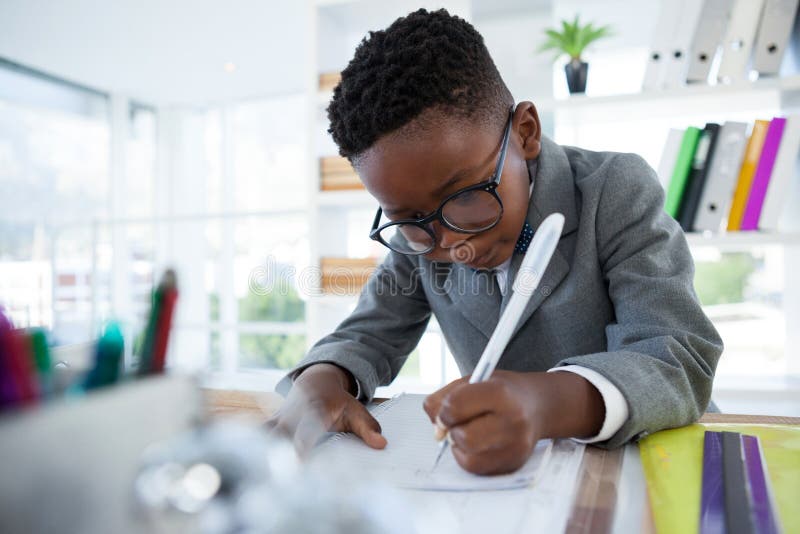 Businessman Writing on Paper at Desk Stock Photo - Image of holding ...