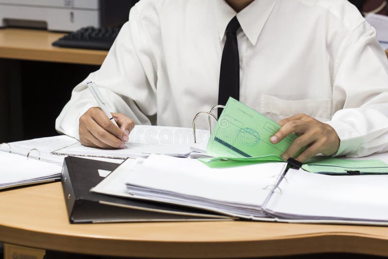 Businessman Writing Paper in File Stock Photo - Image of looking ...