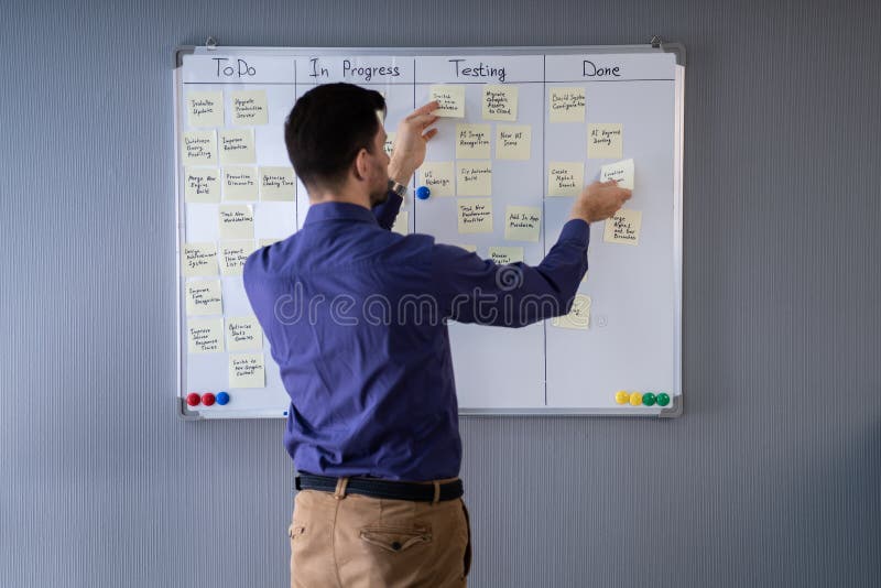 Businessman Writing on Sticky Notes Stock Image - Image of standing ...