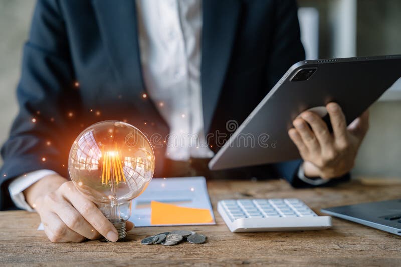 Businessmen Carry Light Bulbs with the Idea of Saving Money, Working ...