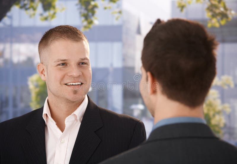 Businessmen Chatting Outside of Office Stock Image - Image of happiness ...