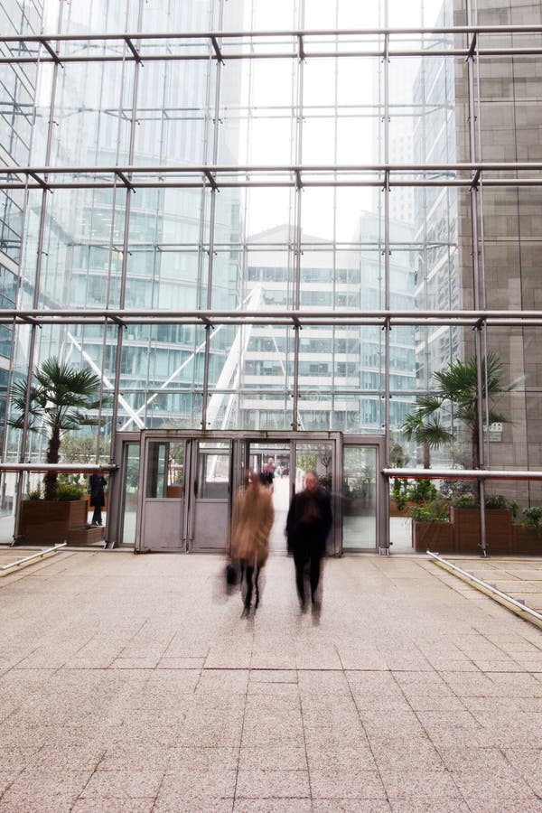 Businessmen Coming Out of an Office Building Stock Image - Image of ...