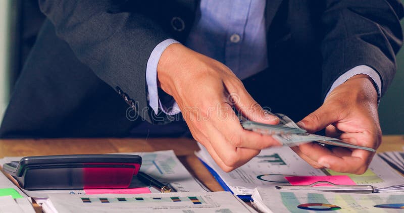 Businessmen Count Money and Plan Finances for Projects and Use ...