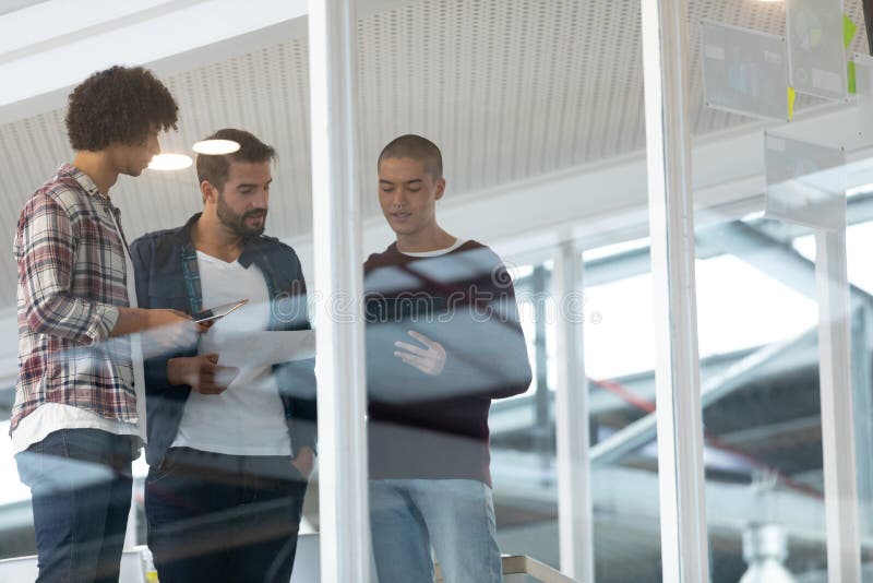 Businessmen Discussing Over Documents in the Office Stock Photo - Image ...