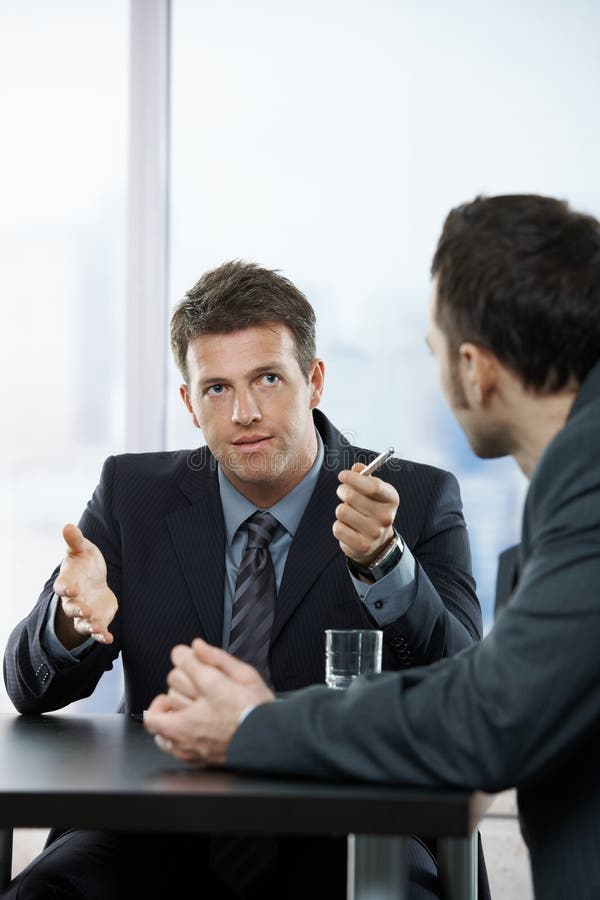 Businessmen at discussion stock image. Image of conference - 64516035