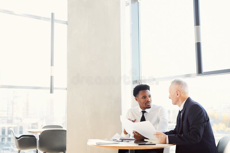 Businessmen Doing Paperwork in Office Stock Photo - Image of success ...