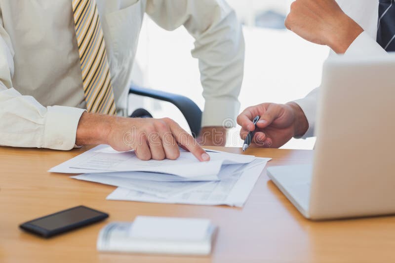 Businessmen Going Over Paperwork Stock Photo - Image of bureau ...