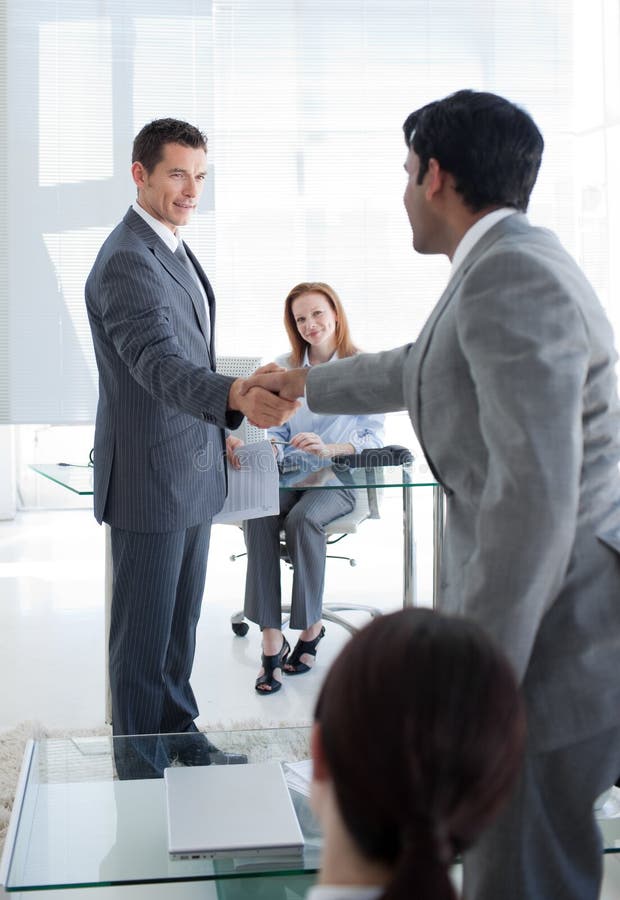 Businessmen Greeting Each Other at a Job Interview Stock Image - Image ...