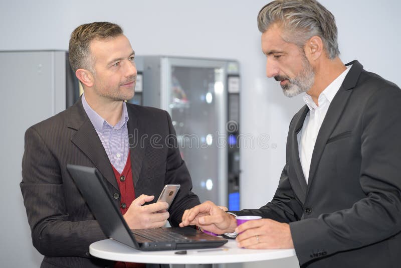 Businessmen Having Tea in Office after Meeting Stock Image - Image of ...