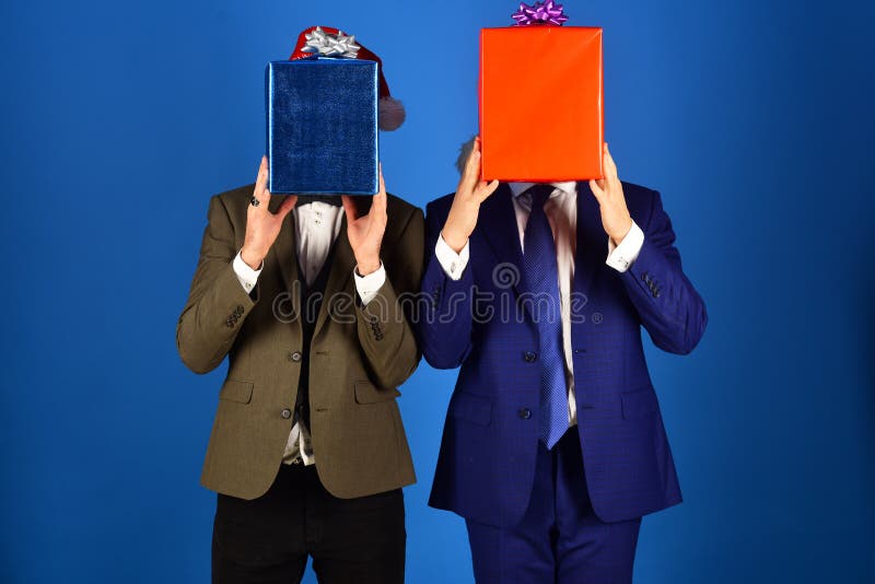 Businessmen Hide Faces Behind Red and Blue Present Boxes Stock Photo ...
