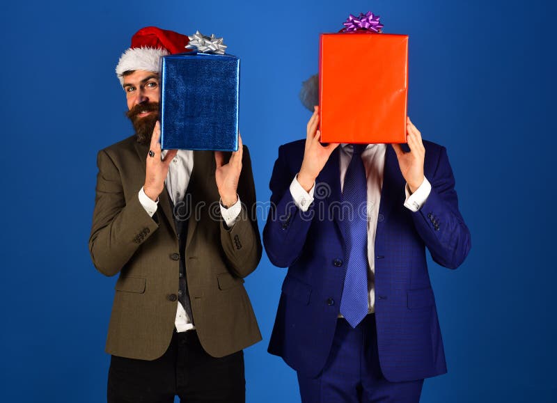 Businessmen Hide Faces Behind Red and Blue Present Boxes. Stock Image ...