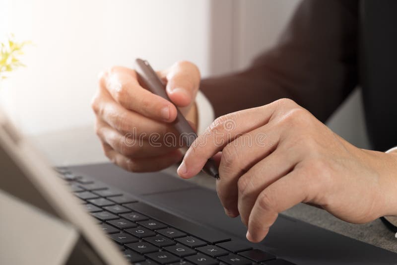 Businessmen are Holding Pens and Sitting Thinking Something on T Stock ... Businessmen are Holding Pens and Sitting Thinking Something on T Stock ...
