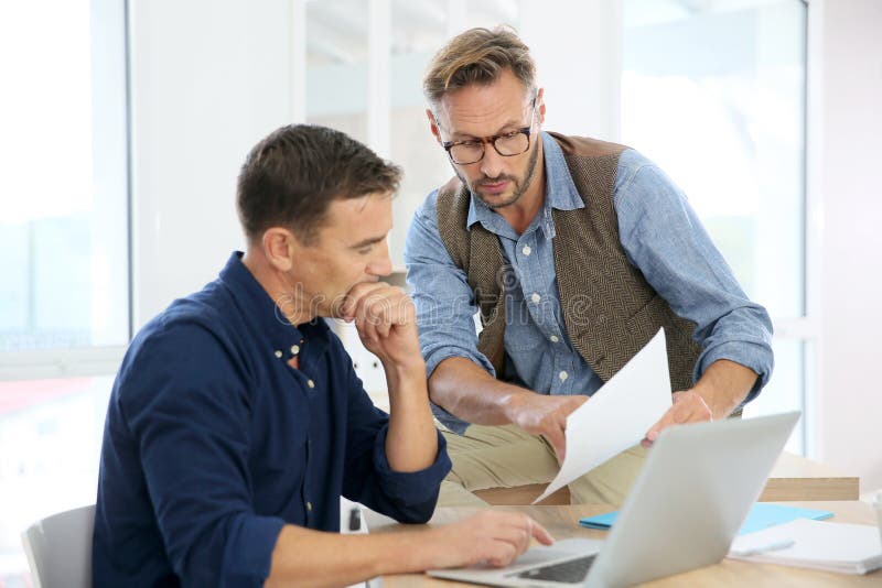 Businessmen at Office Working on a Project Stock Photo - Image of desk ...