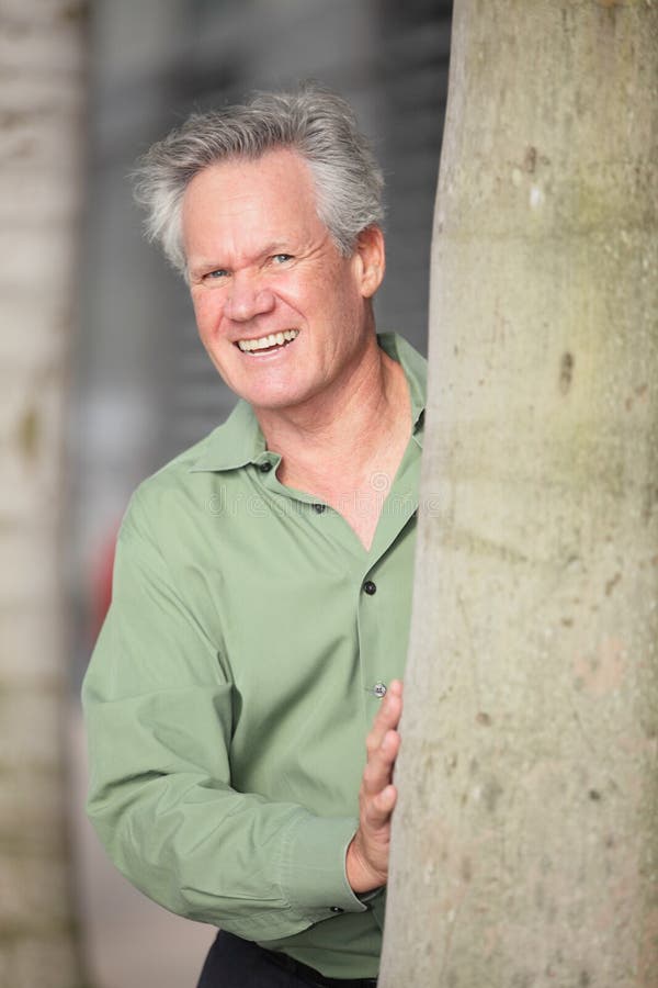 Businessmen Posing Behind a Tree Stock Photo - Image of businessman ...