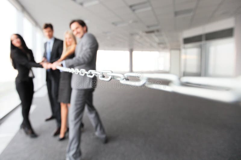 Businessmen pulling chain stock image. Image of unity - 58235659