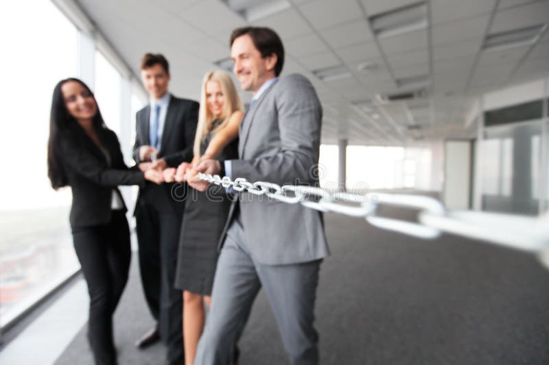 Businessmen pulling chain stock photo. Image of unity - 59323738