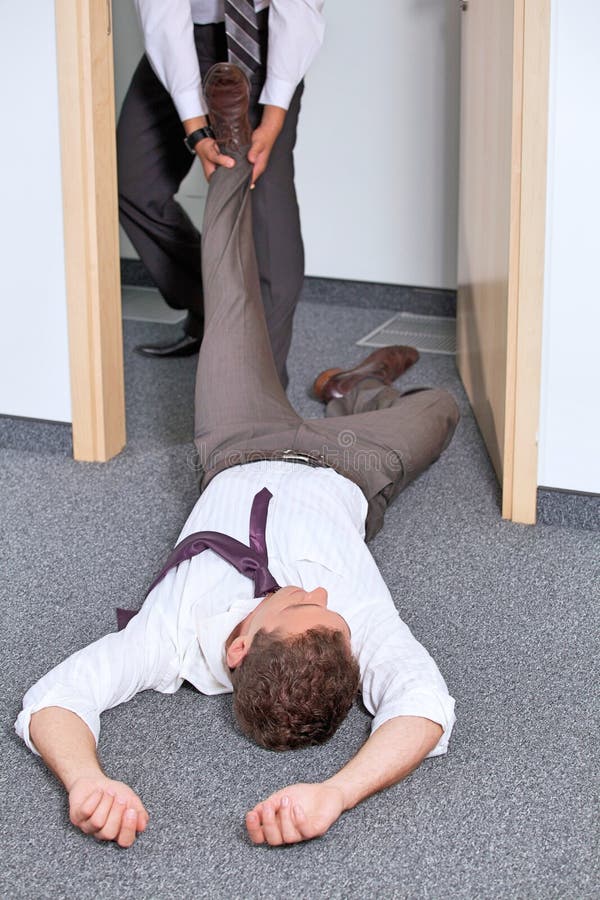 Businessmen Pulling Colleague S Leg at Office Stock Photo - Image of ...