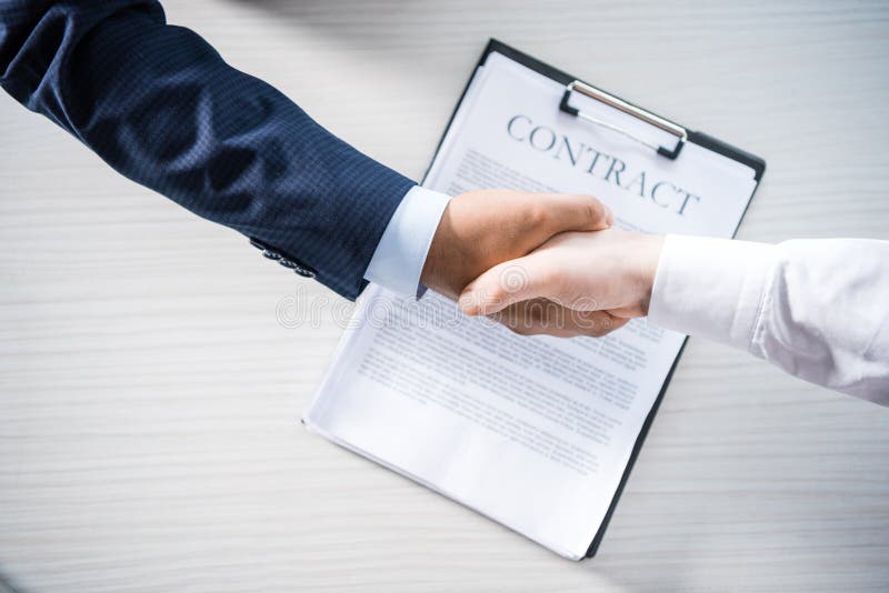 Businessmen Shaking Hands with Contract on Table Stock Photo - Image of ...