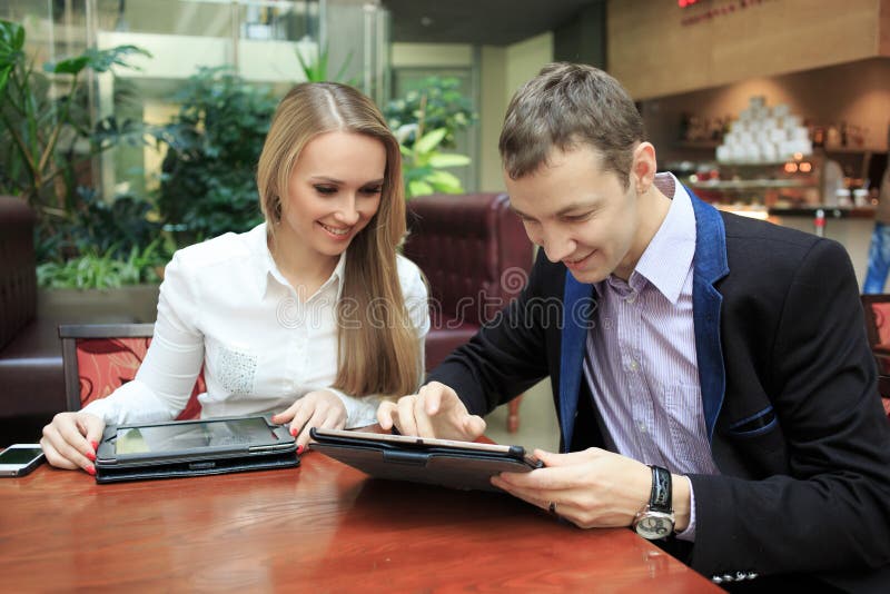 Businessmen Sitting in Cafe for a Laptop Stock Image - Image of ...