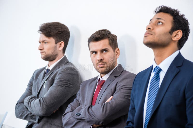 Businessmen Sitting in Queue and Waiting for Interview in Office Stock ...