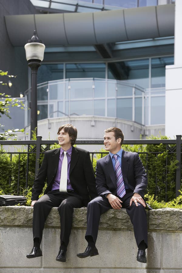 Businessmen Sitting Wall Outside Office Stock Photos - Free & Royalty ...