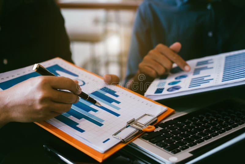 Businessmen Team or Financial Data Analysts Working with Data Graphs ...