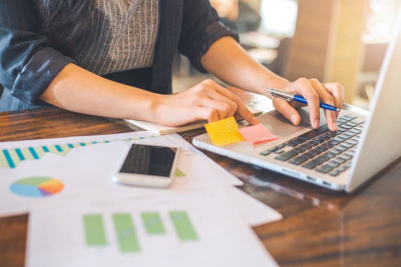 Businessmen are Using a Computer To Analysis Charts and Graphs R Stock ...